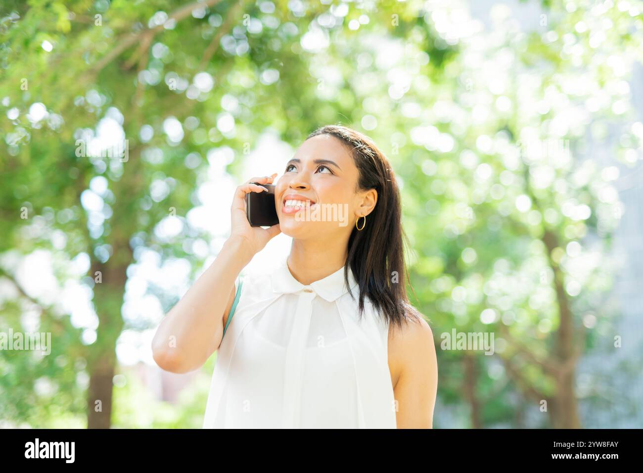 Half-woman making a phone call in the street Stock Photo - Alamy
