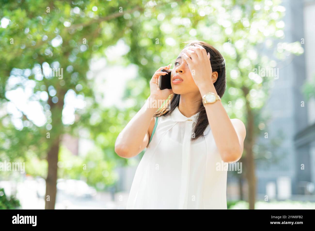 Half-woman making a phone call in the street Stock Photo - Alamy