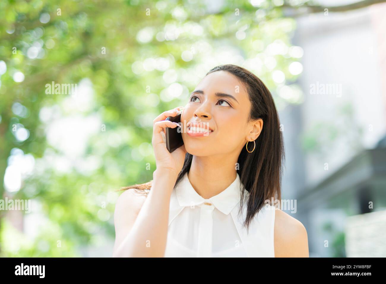 Half-woman making a phone call in the street Stock Photo - Alamy
