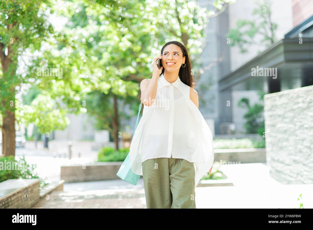 Half-woman making a phone call in the street Stock Photo - Alamy