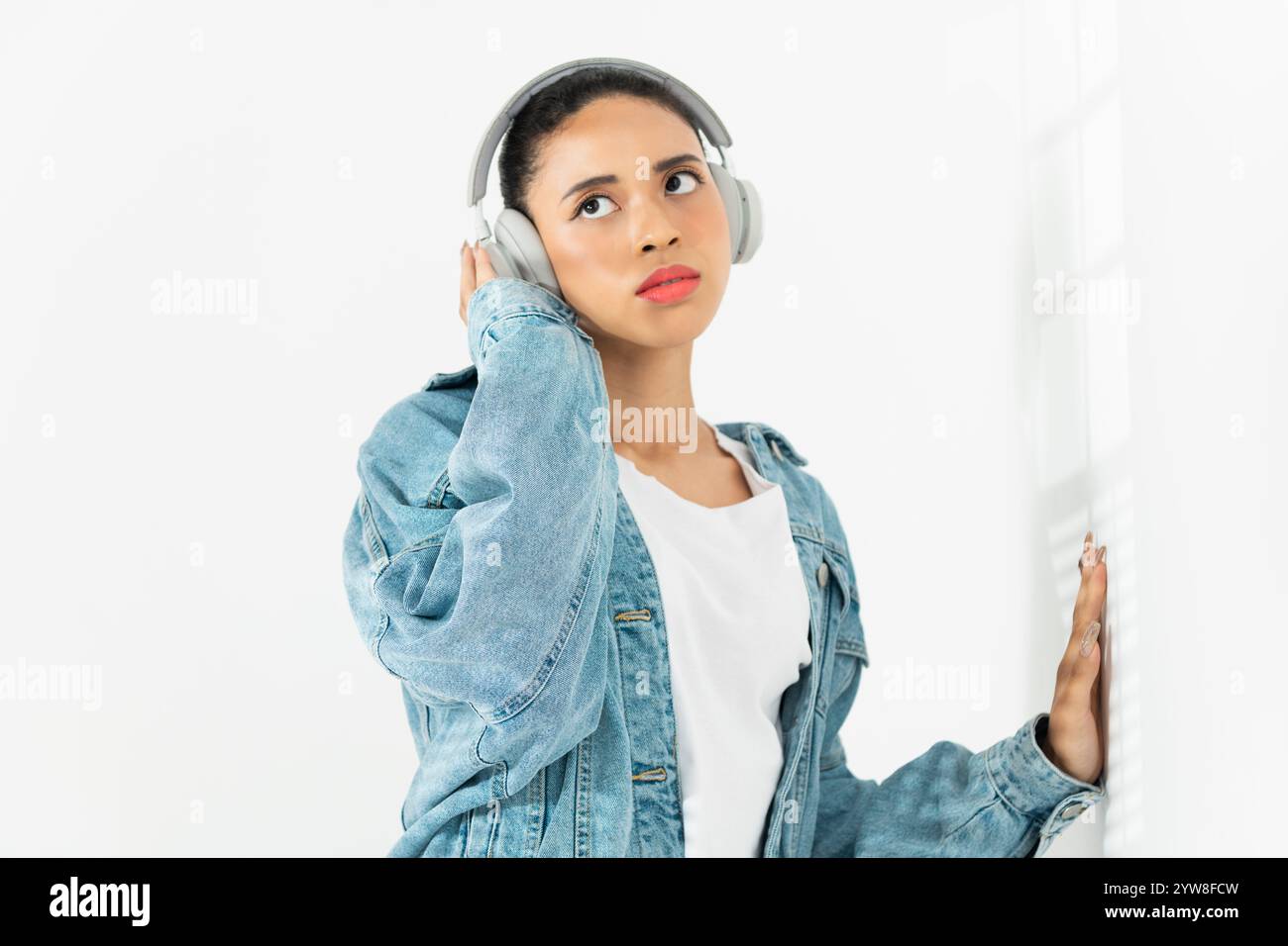 Half women listening to music Stock Photo - Alamy