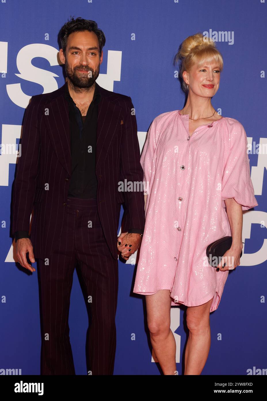 London, UK. 08th Dec, 2024. Alex Hassell and Emma King attend the 27th ...