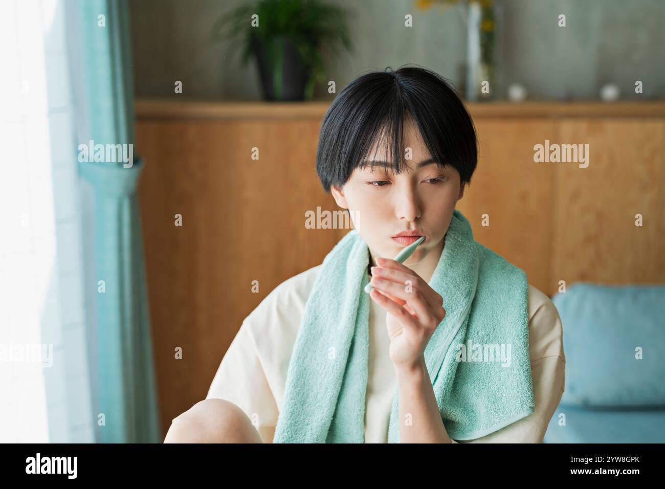 Woman brushing her teeth after bathing Stock Photo - Alamy