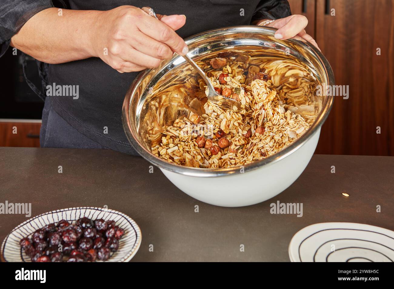 Granola mixing process hi-res stock photography and images - Alamy