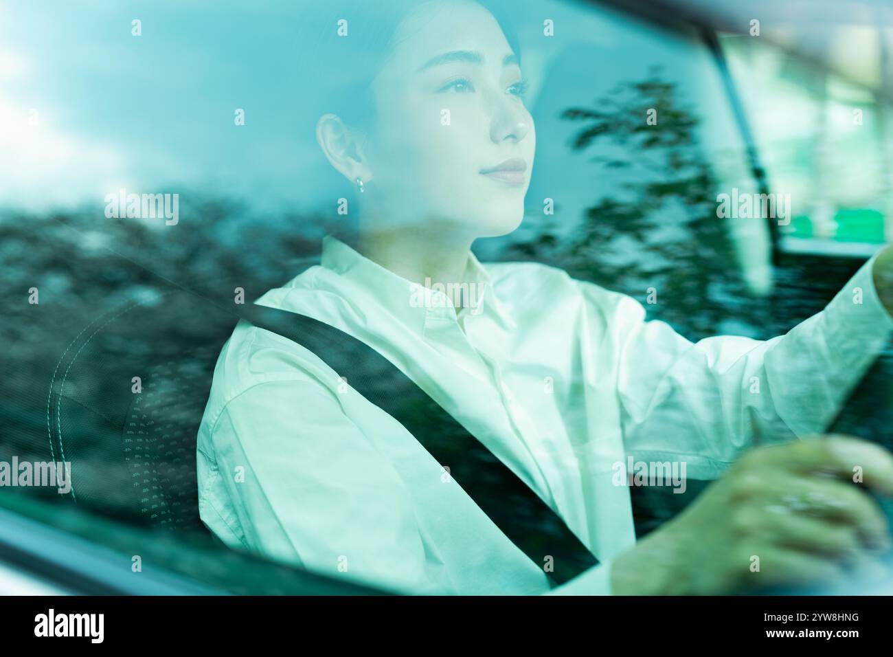 Woman driving a car, window reflection Stock Photo - Alamy
