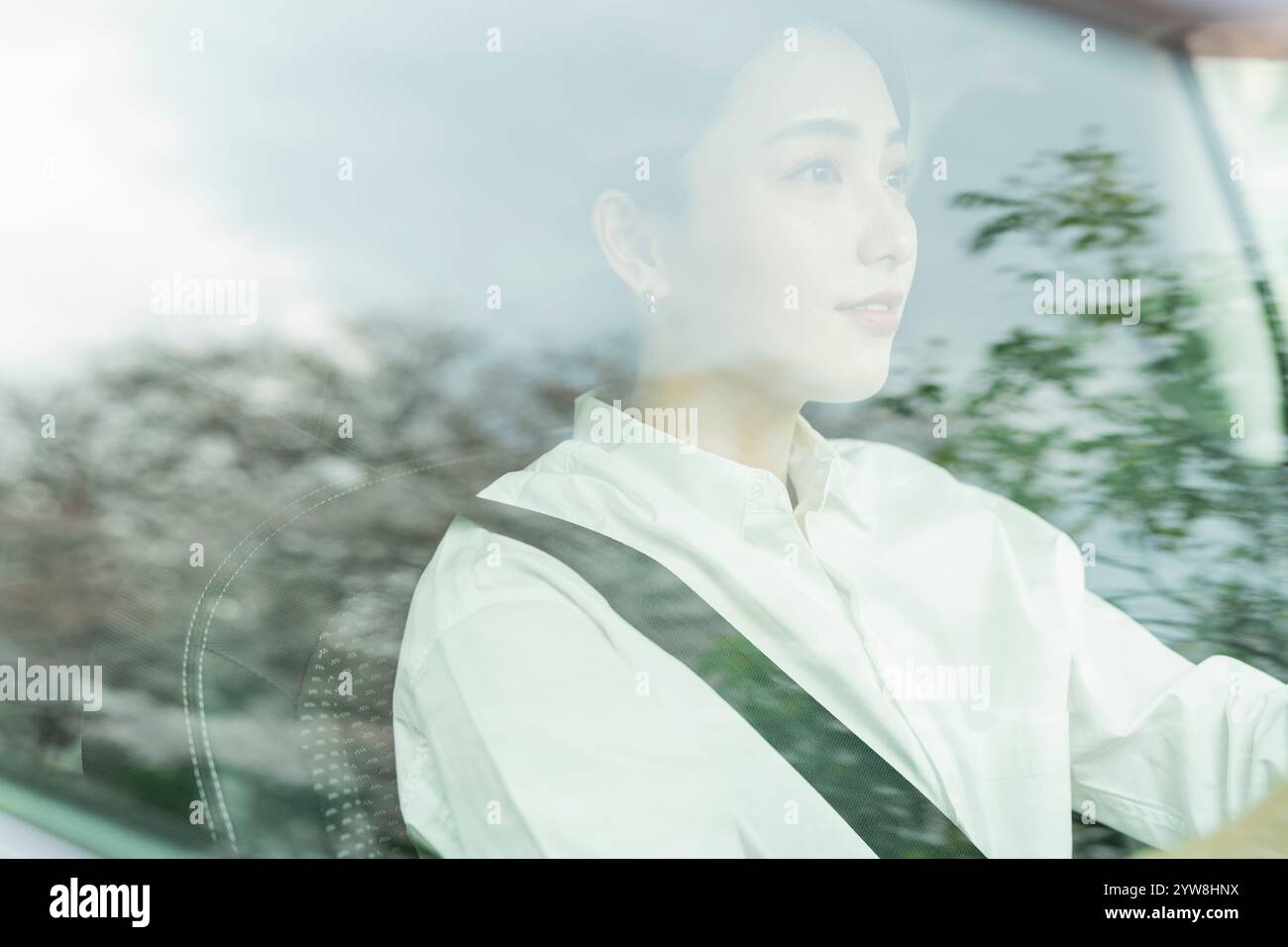 Woman driving a car, window reflection Stock Photo - Alamy