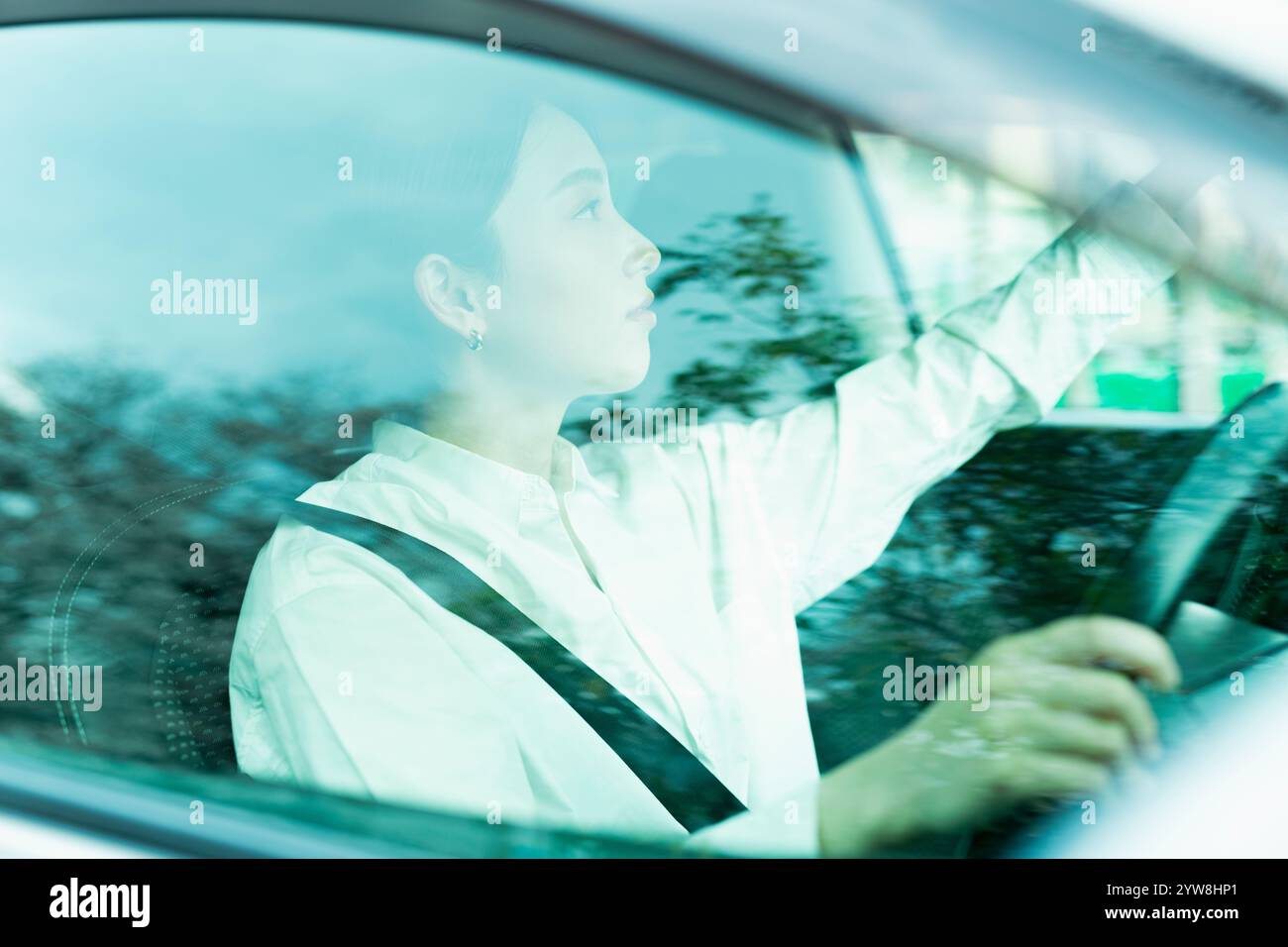 Woman driving a car, window reflection Stock Photo - Alamy