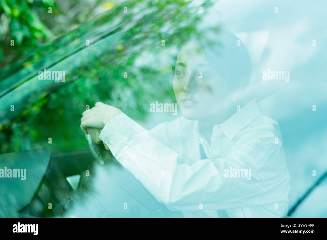 Woman driving a car, window reflection Stock Photo - Alamy