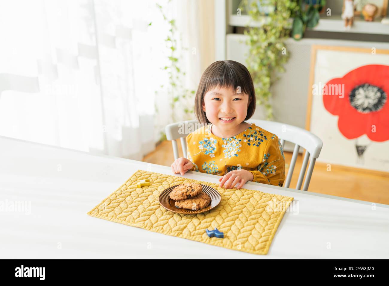 Girl eating a snack Stock Photo - Alamy