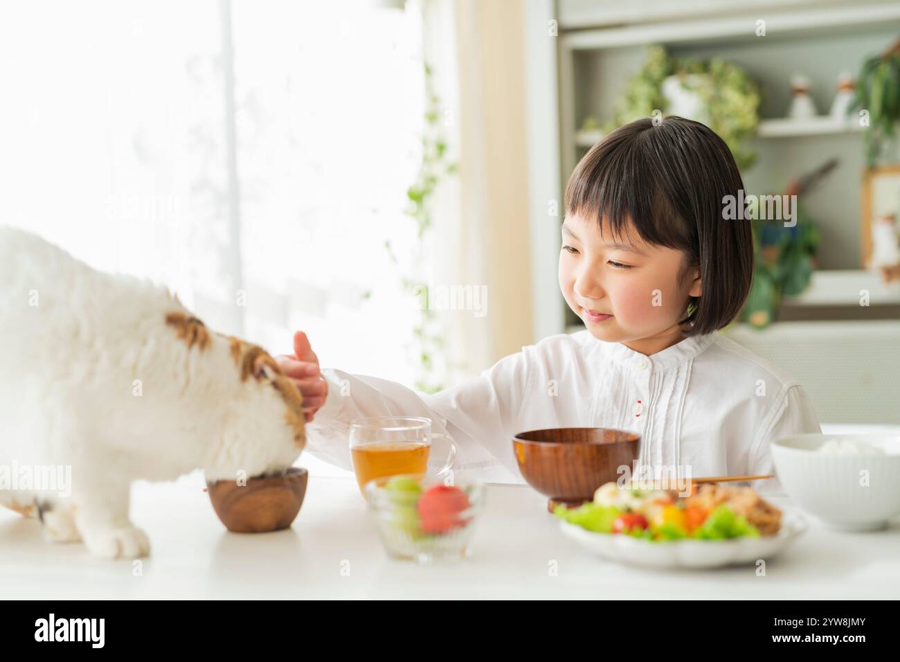 Cute girl eating soup hi-res stock photography and images - Alamy