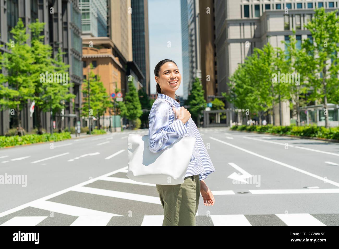 Half-woman crossing the pedestrian crossing Stock Photo - Alamy