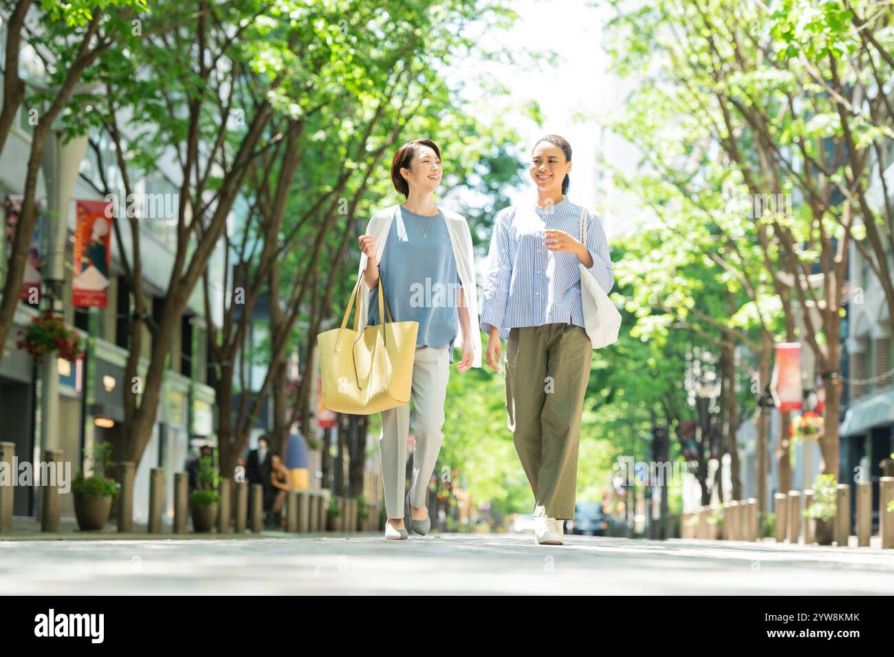 Two person walking american hi-res stock photography and images - Alamy