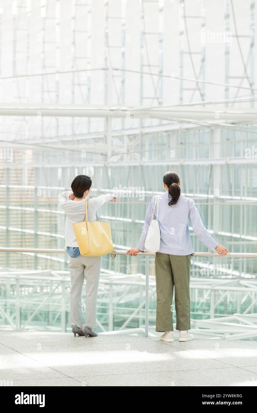 Portrait two women walking outdoors hi-res stock photography and images ...