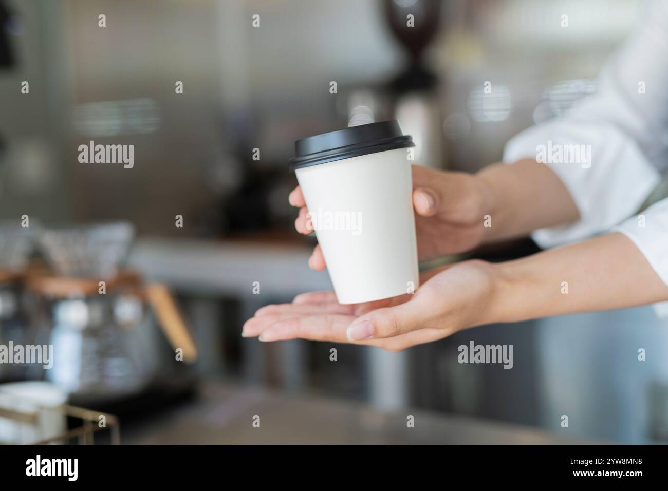 Handing coffee hi-res stock photography and images - Alamy