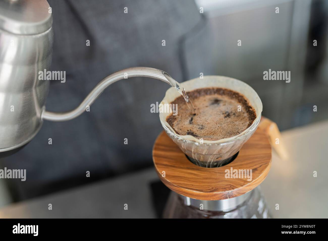 Café Female staff making coffee Stock Photo - Alamy