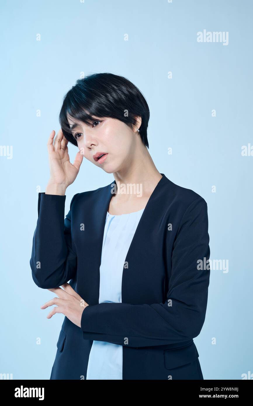 Female office worker with short hair who looks out of shape Stock Photo ...