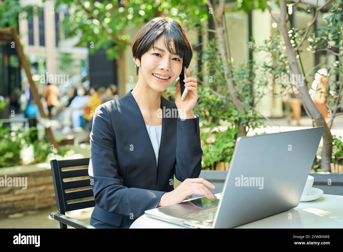 Woman making personal call in office hi-res stock photography and ...
