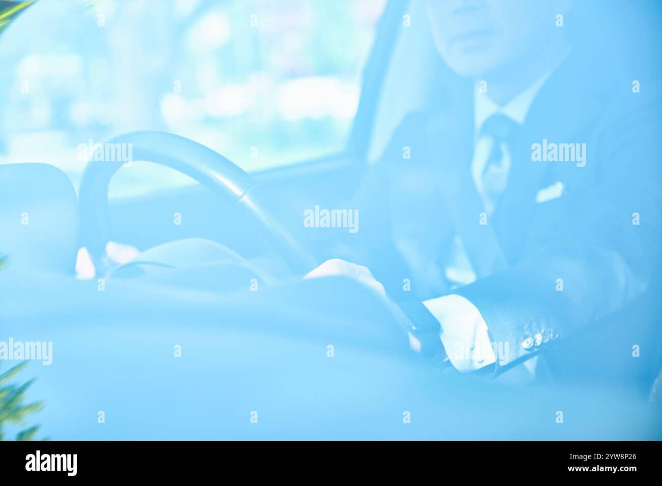 Company employee in his 50s driving a car, windscreen Stock Photo - Alamy