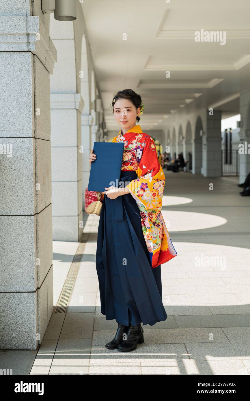 Female university students celebrating their graduation Stock Photo - Alamy