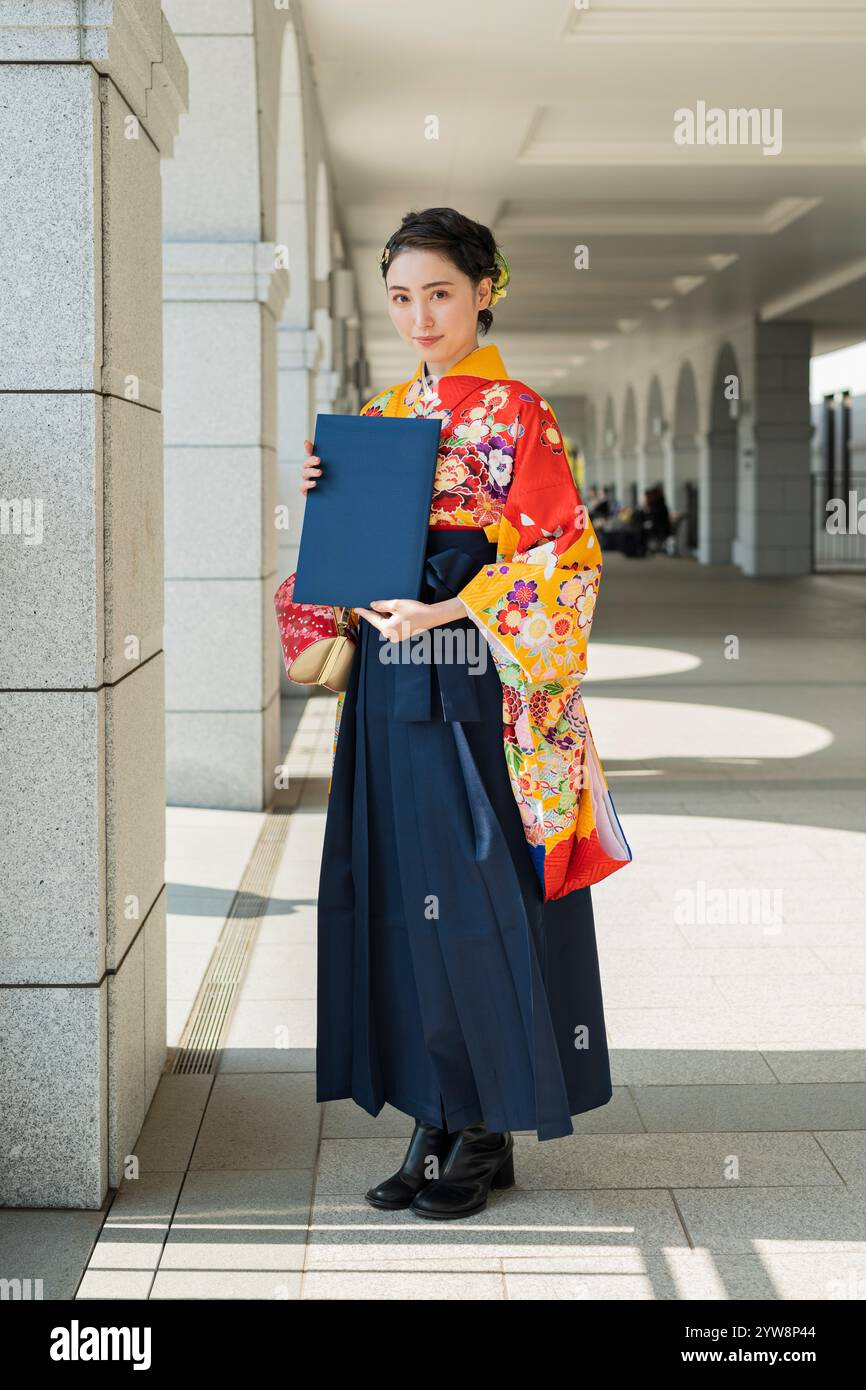 Female university students celebrating their graduation Stock Photo - Alamy