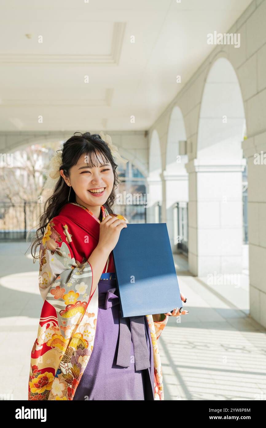Female university students celebrating their graduation Stock Photo - Alamy