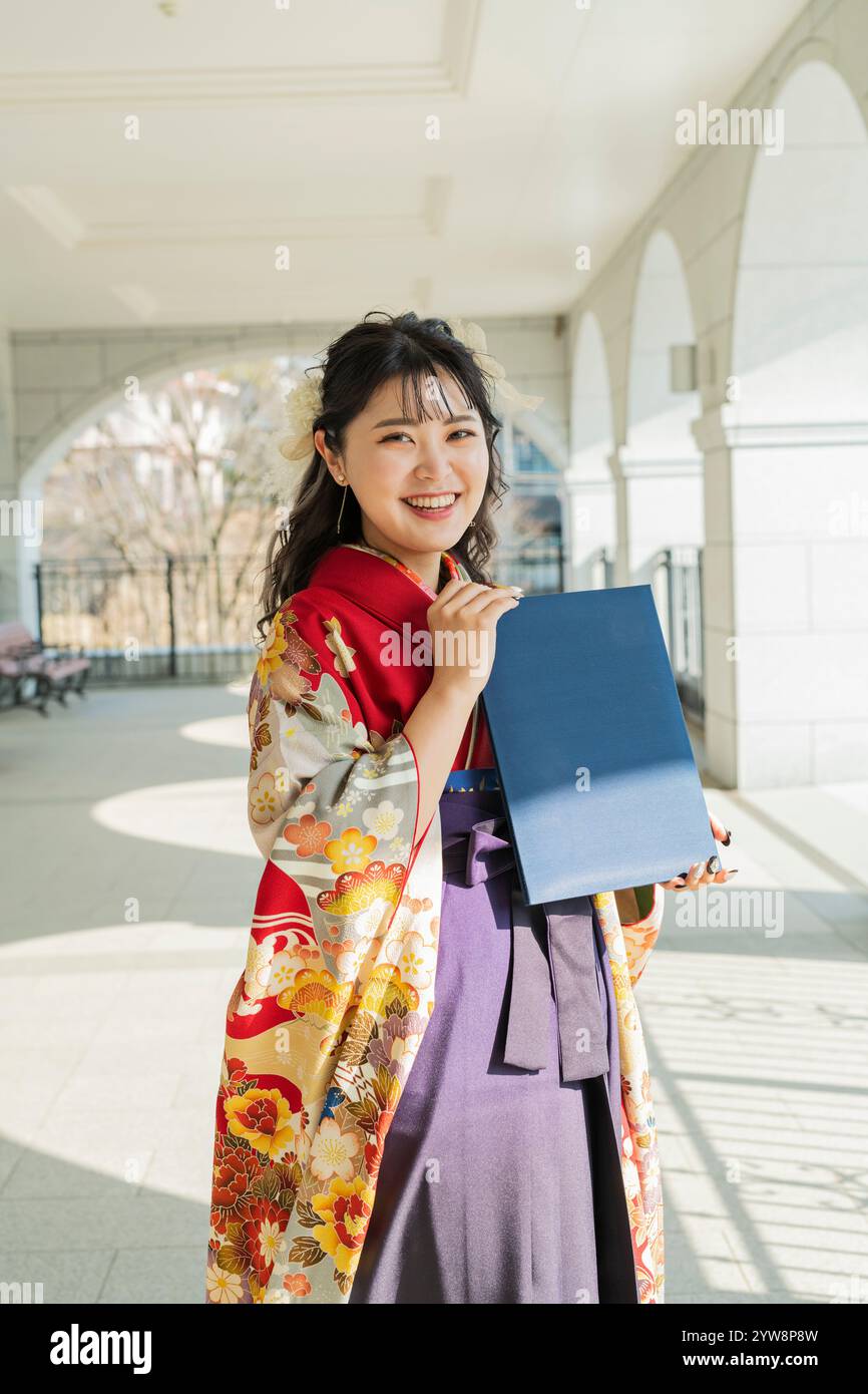 Female university students celebrating their graduation Stock Photo - Alamy