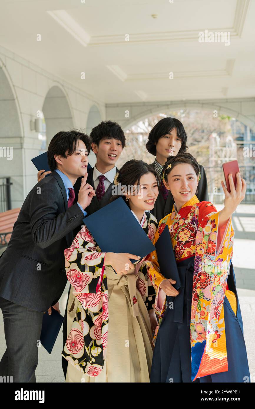 Graduation ceremony College students taking photos at graduation ...