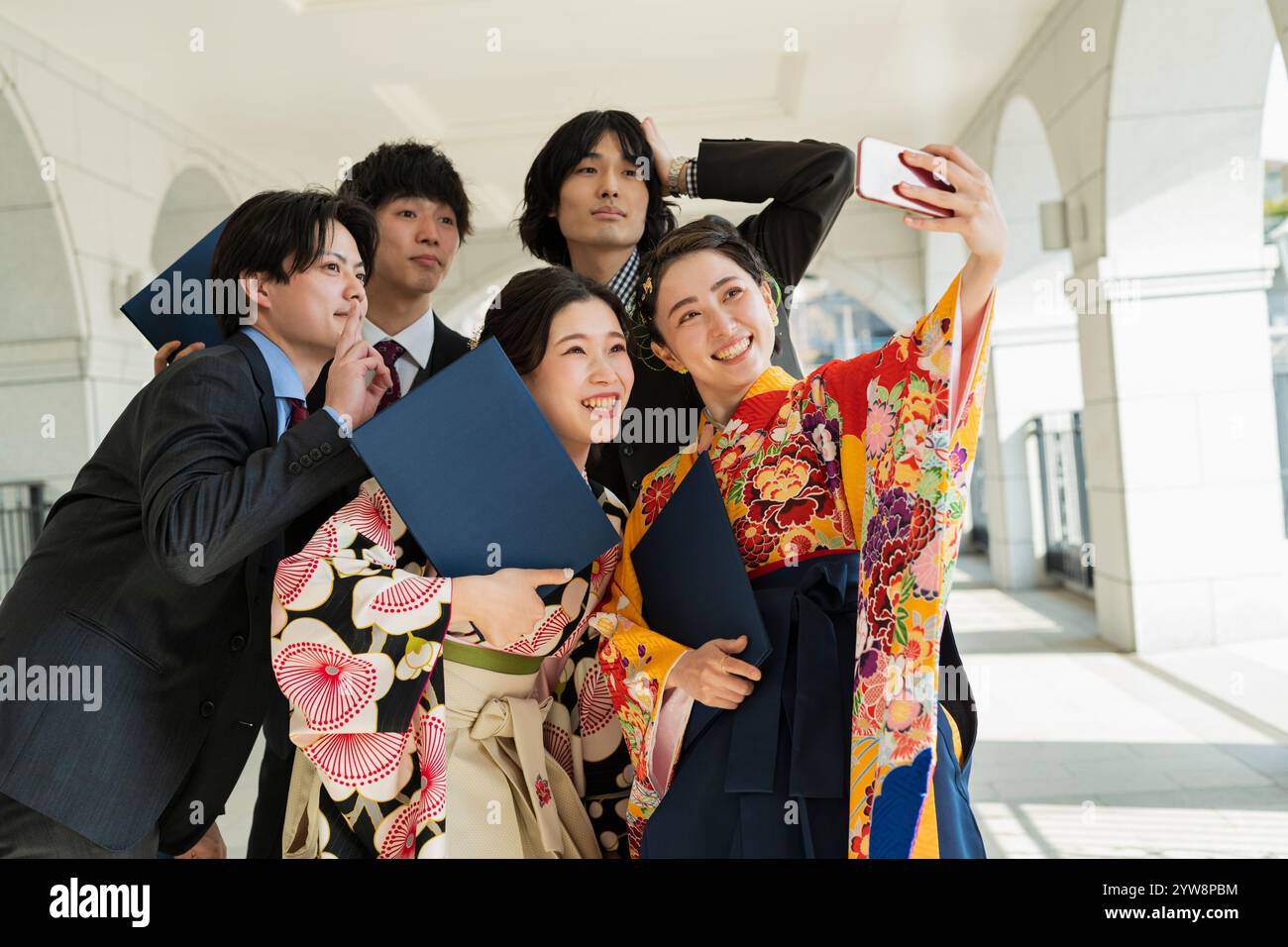 Graduation ceremony College students taking photos at graduation ...