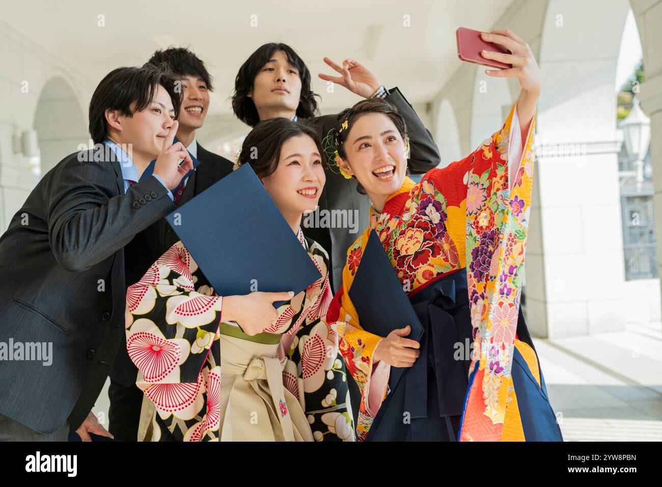 Graduation ceremony College students taking photos at graduation ...