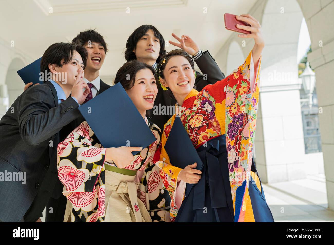 Graduation ceremony College students taking photos at graduation ...
