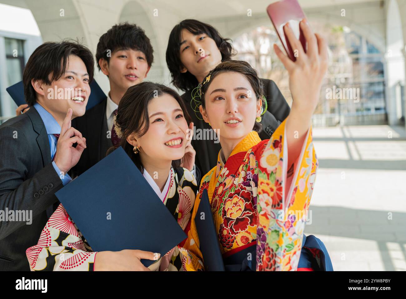 Graduation ceremony College students taking photos at graduation ...