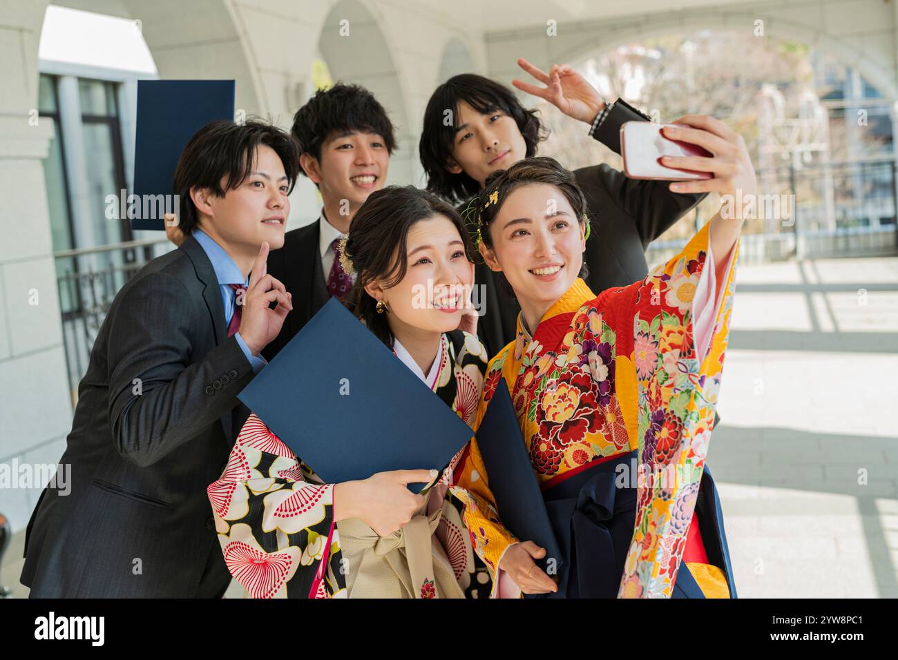 Graduation ceremony College students taking photos at graduation ...