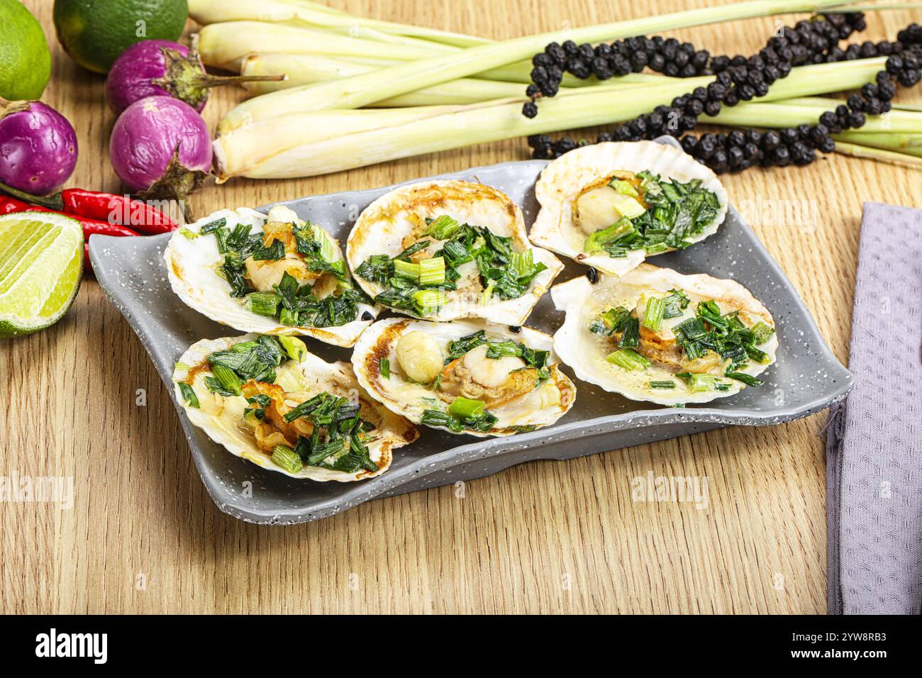 Grilled scallops with green onion and sauce Stock Photo - Alamy