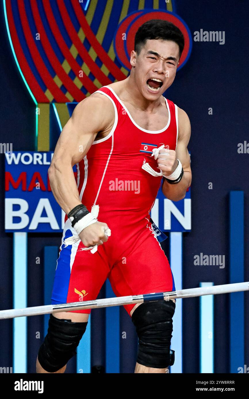 Ryong Hyon Ri of North Korea celebrates after competing in snatch, in ...