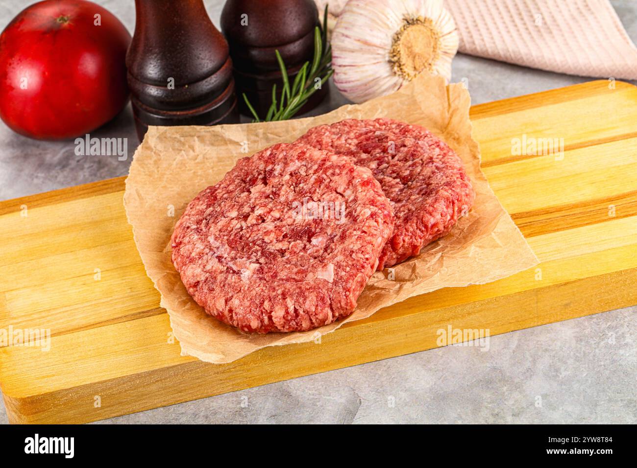 Raw round uncooked beef cutlet minced meat Stock Photo - Alamy
