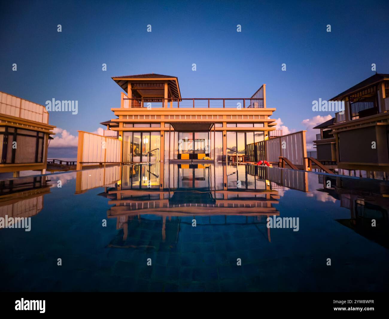 Sunset views from overwater pool villa in Maldives Stock Photo - Alamy