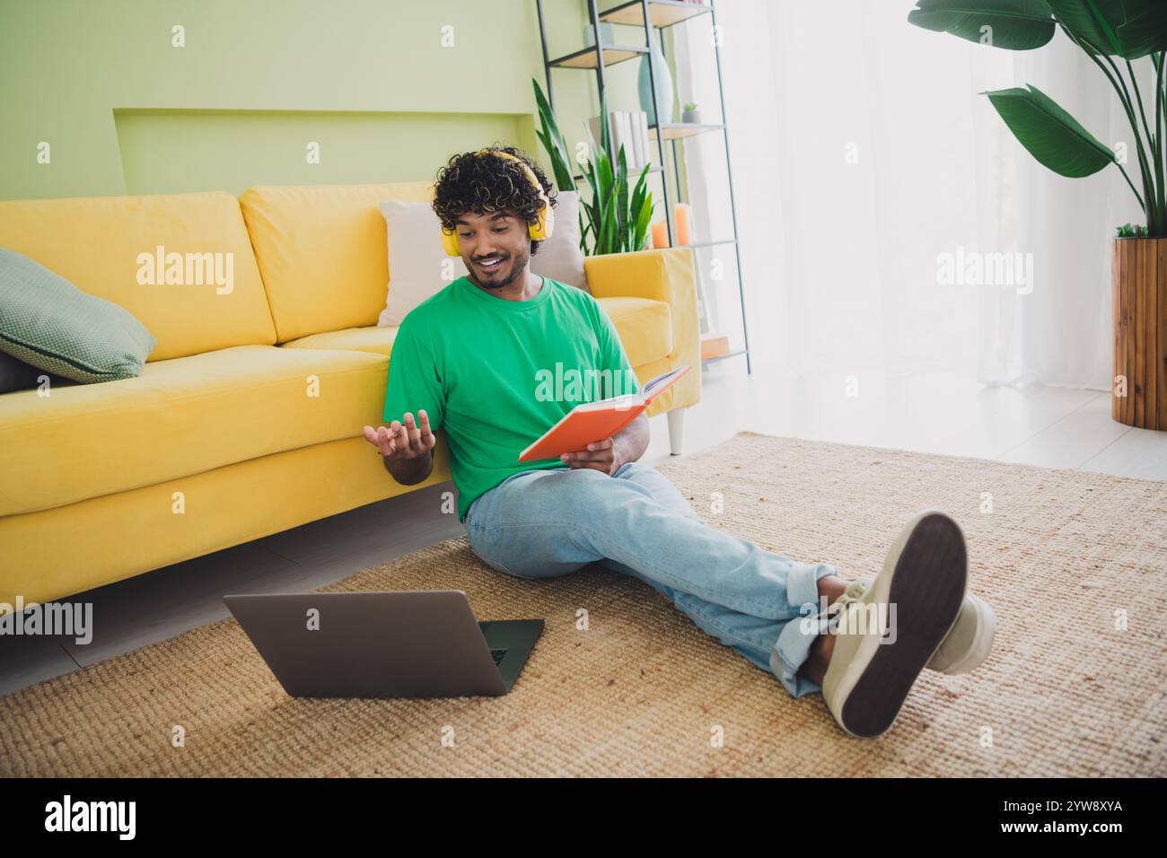 Full size photo of nice young man hold notepad video call laptop ...