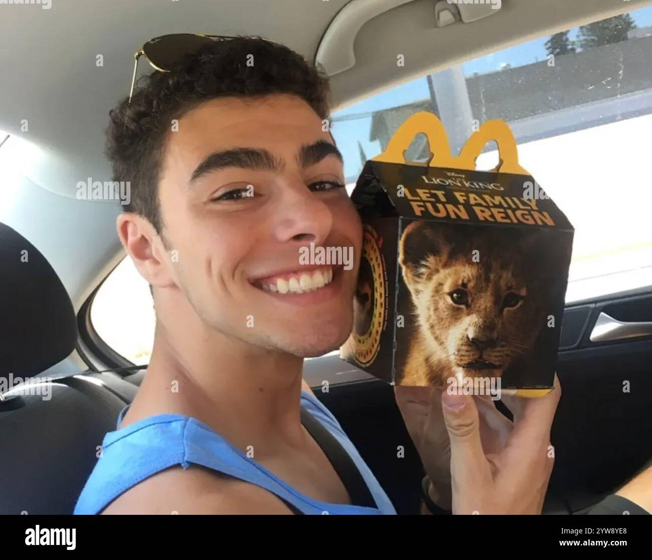 2019: LUIGI MANGIONE, 26, holding a McDonald's Disney 'LionKing Let ...