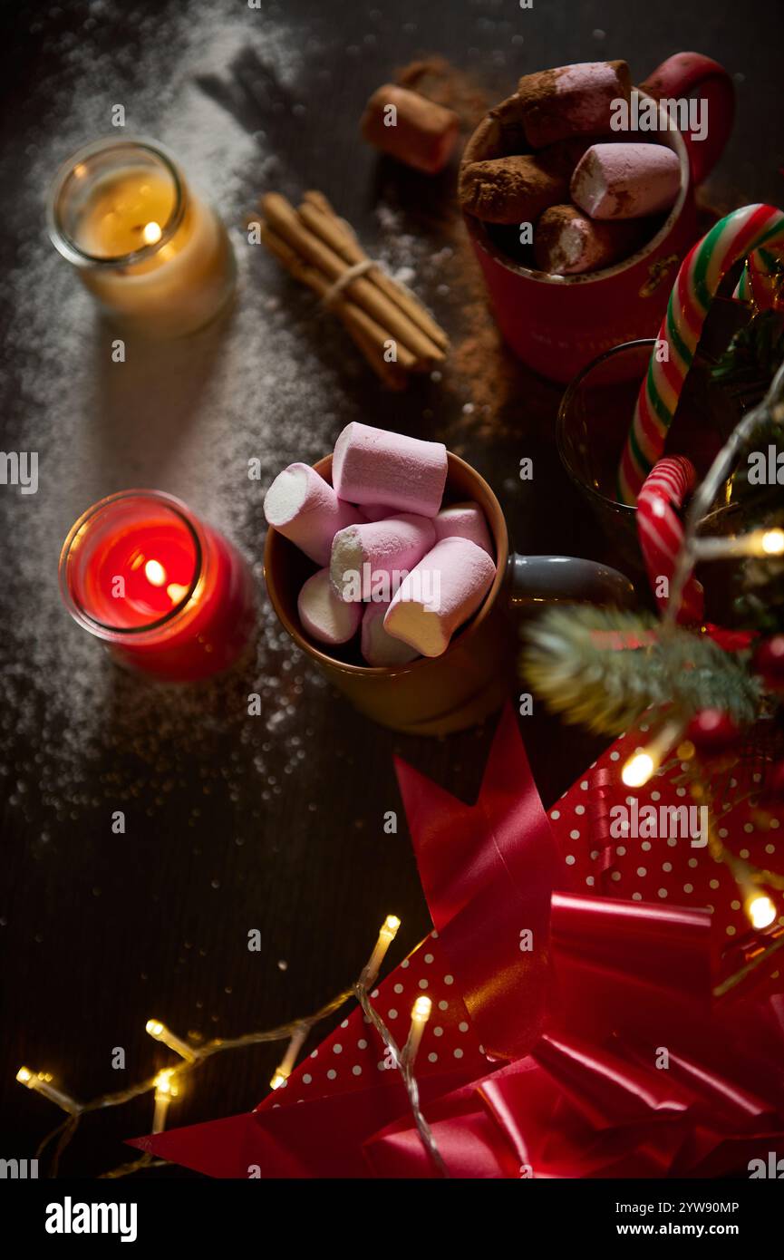 Warm and inviting hot chocolate setup with marshmallows, lit candles ...