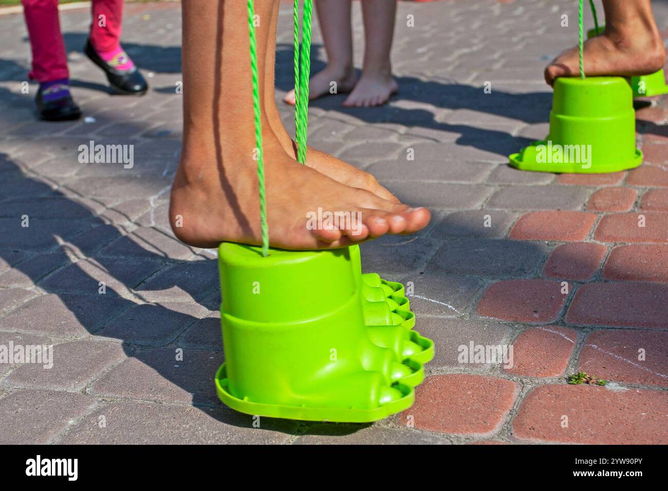 Children stilt walking stilts hi-res stock photography and images - Alamy