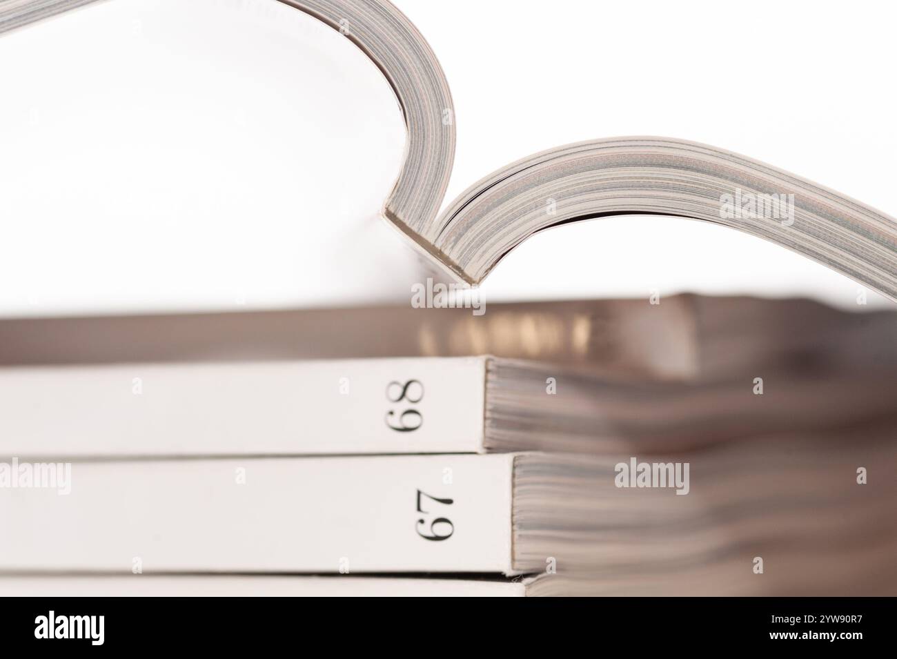 A book is open to page number 67, 68. The pages are white and the book ...