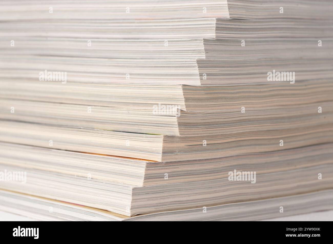 A stack of papers with the top one being the thinnest. The stack is ...