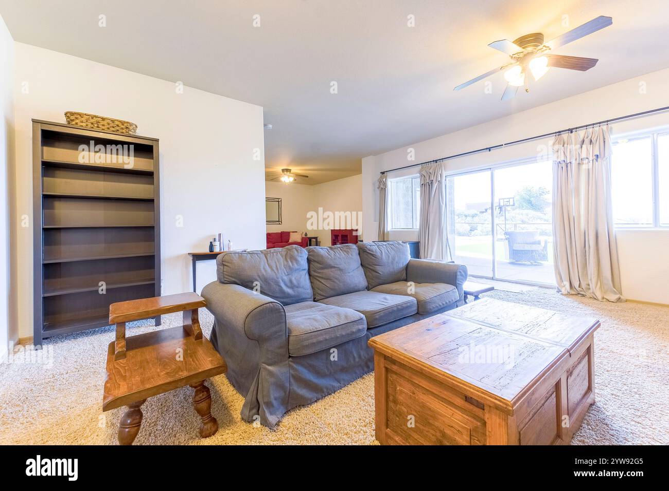 Cozy living room with a comfortable couch and bright natural light in a ...