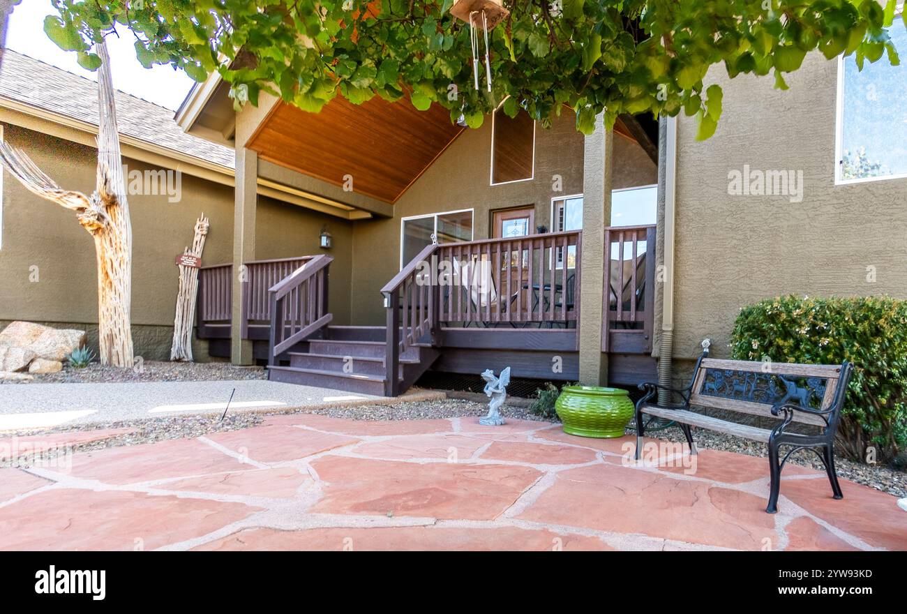 Front porch view of a charming home surrounded by landscaping with a ...