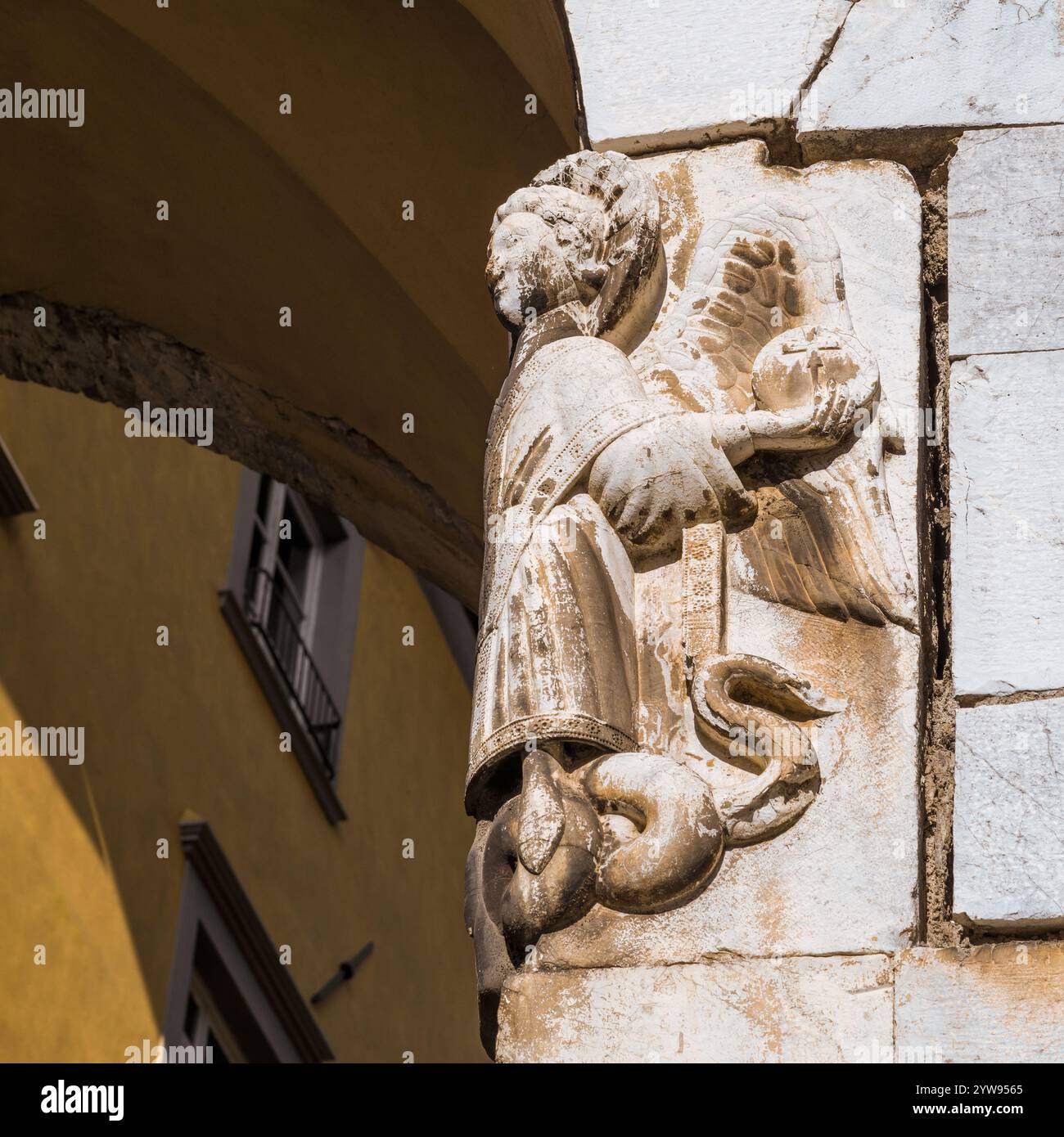 Medieval angel relief on a Lucca historical center ancien wall Stock ...