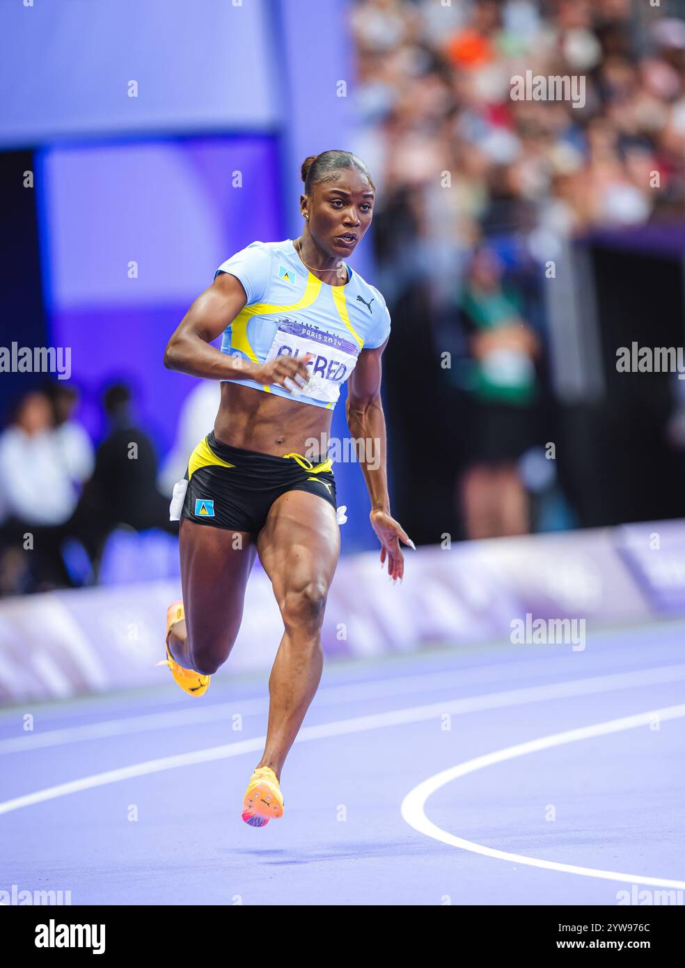 Julien Alfred participating in the 200 meters relay at the Paris 2024 ...