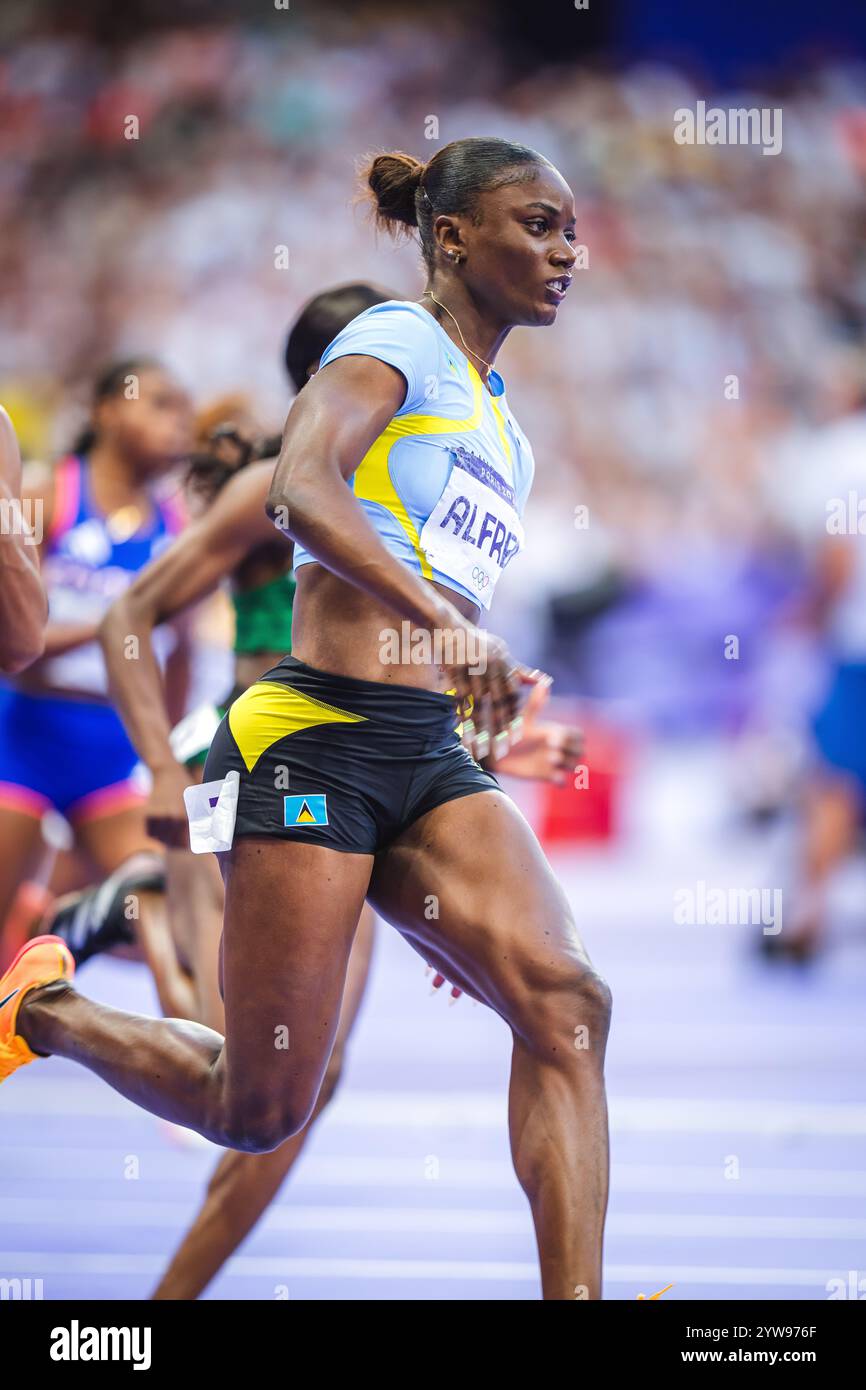 Julien Alfred participating in the 200 meters relay at the Paris 2024 ...