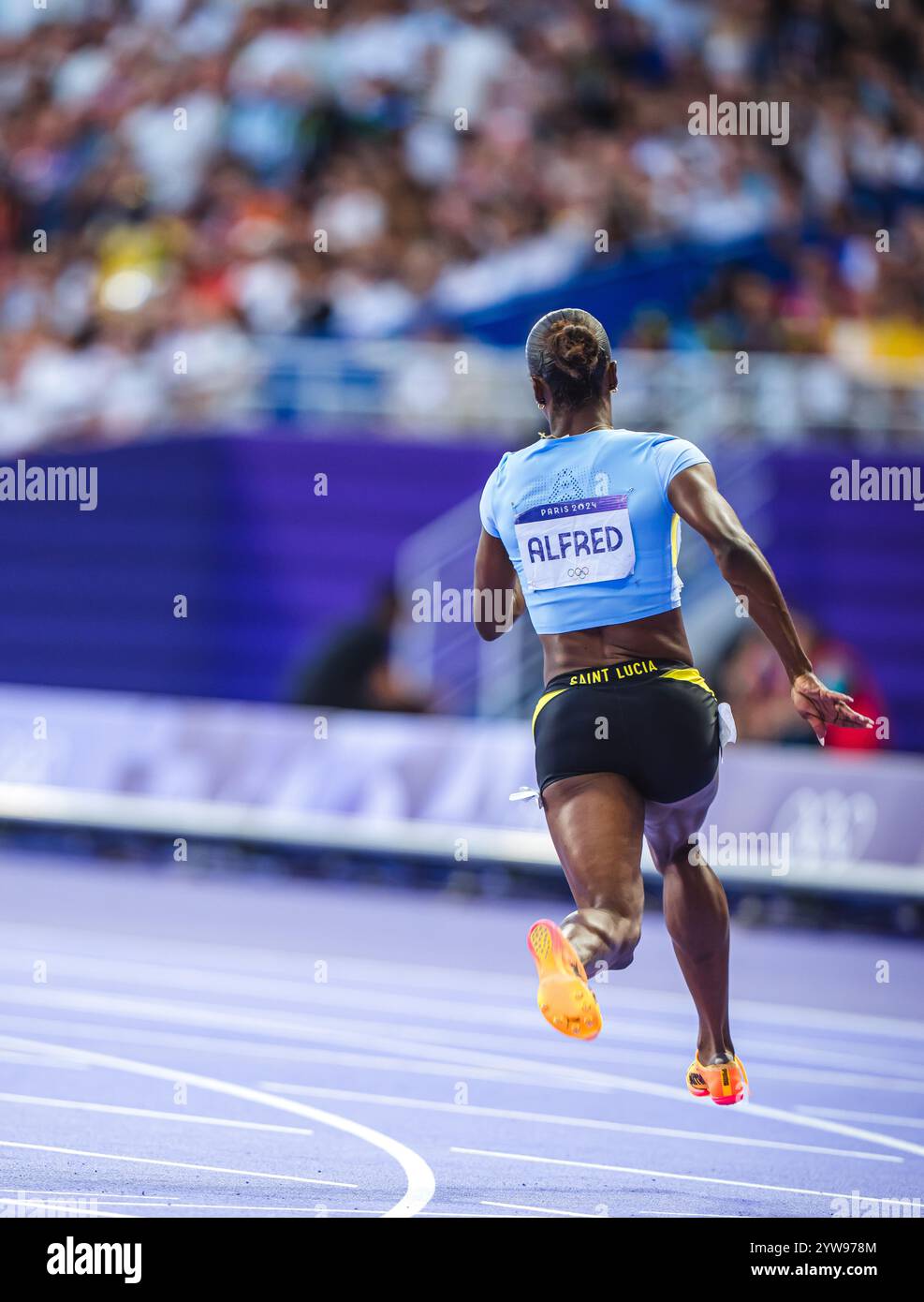 Julien Alfred participating in the 200 meters relay at the Paris 2024 ...