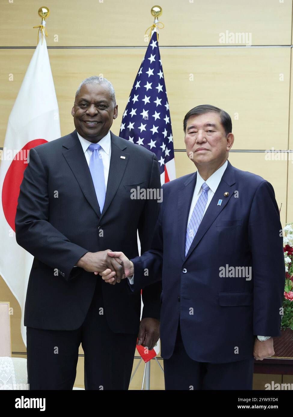 Japan's Prime Minister Shigeru Ishiba (R) receives a courtesy visit ...