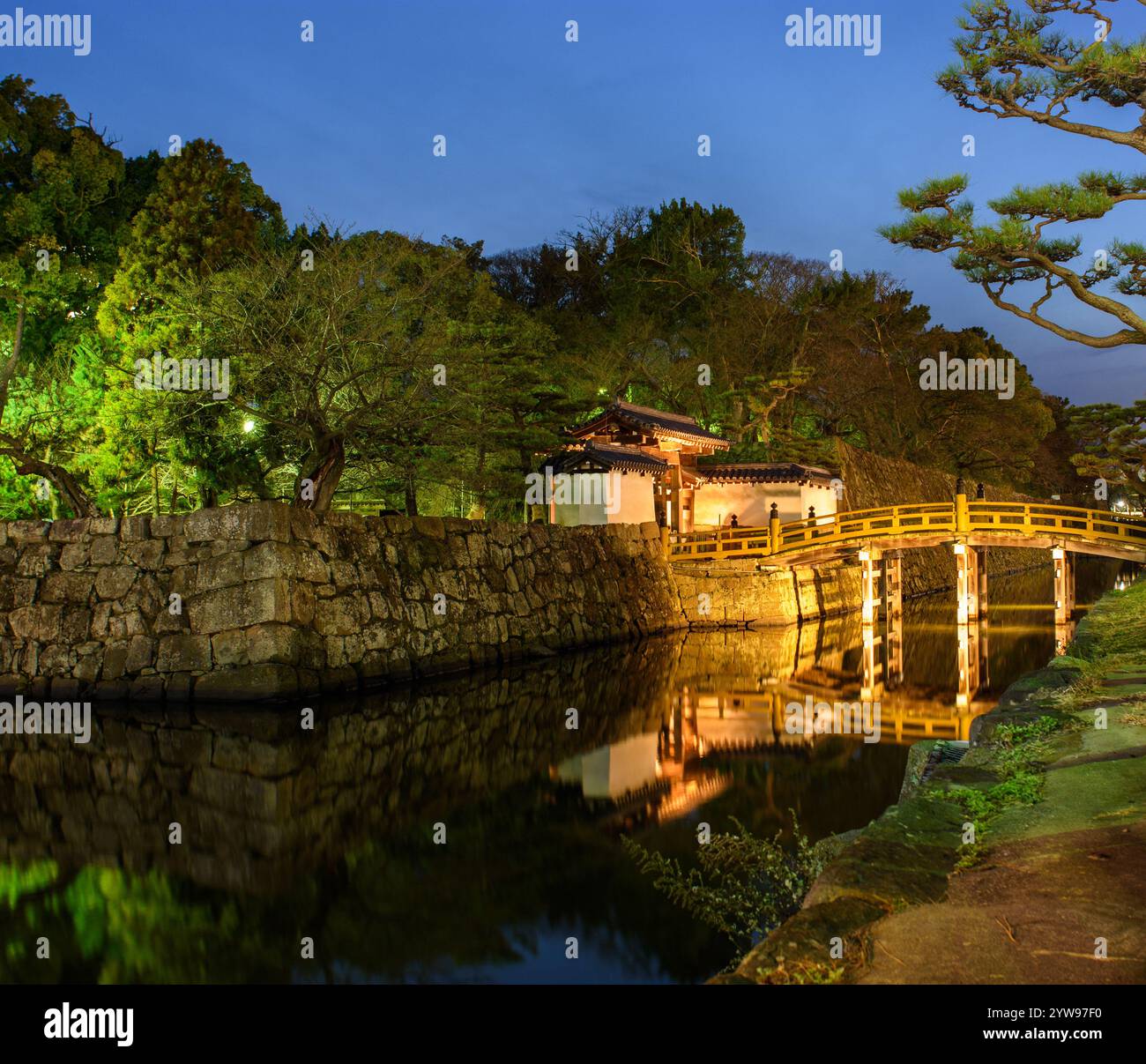 Bridge over water moat at the entrance of Wakayama castle, old historic ...